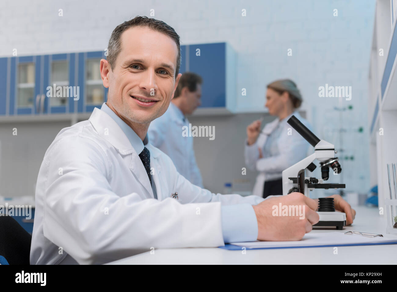lab technician taking notes Stock Photo - Alamy