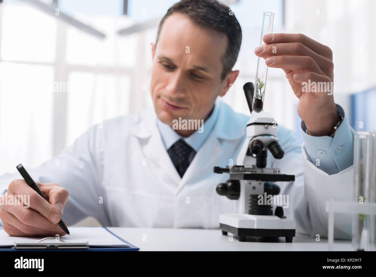 lab technician taking notes Stock Photo - Alamy