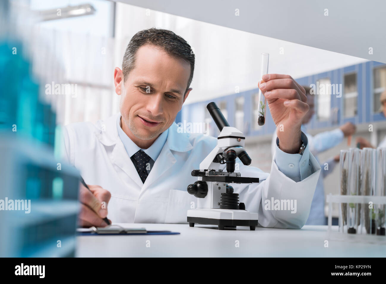 lab technician taking notes Stock Photo - Alamy
