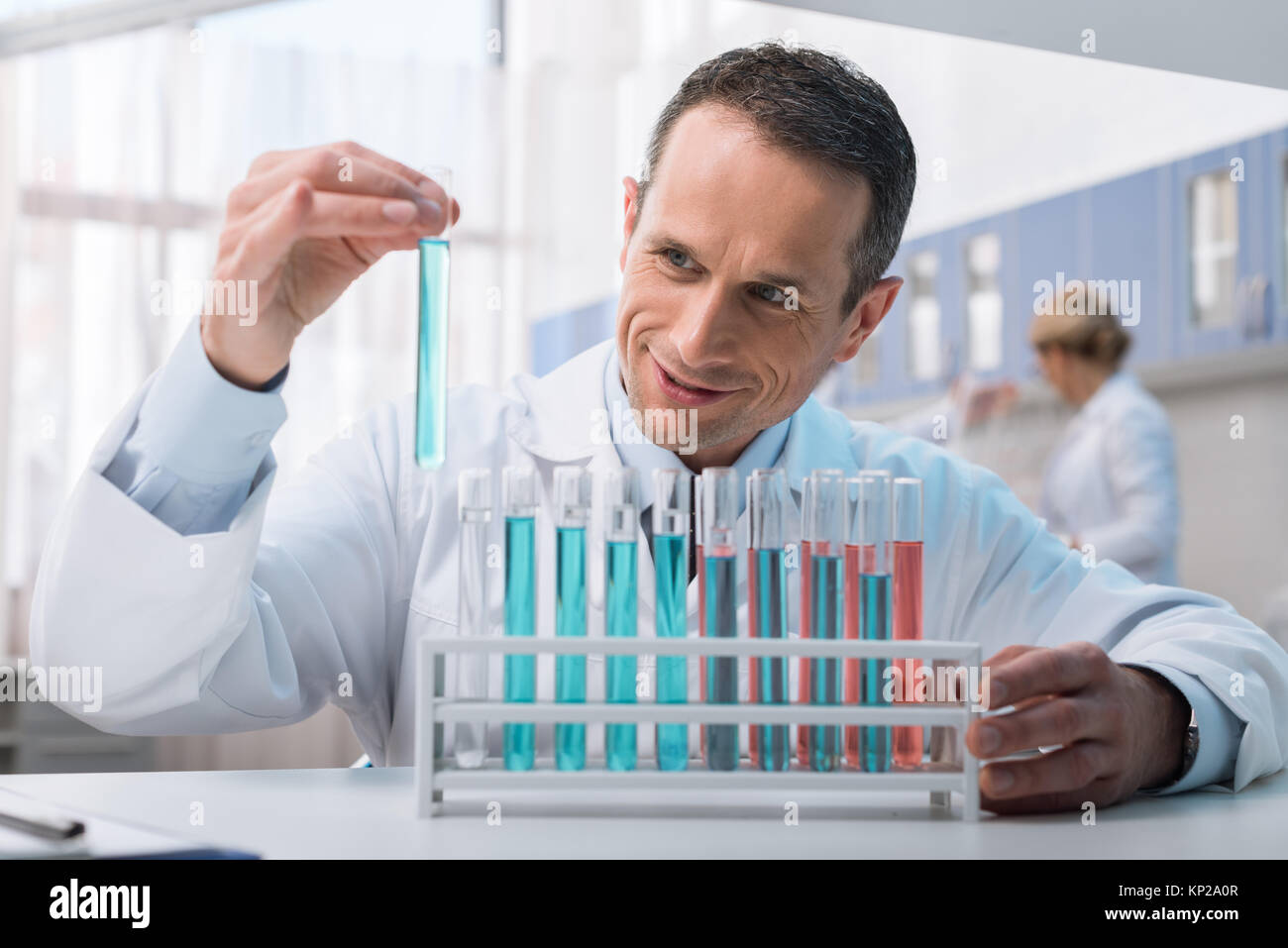 scientist holding test tube Stock Photo - Alamy