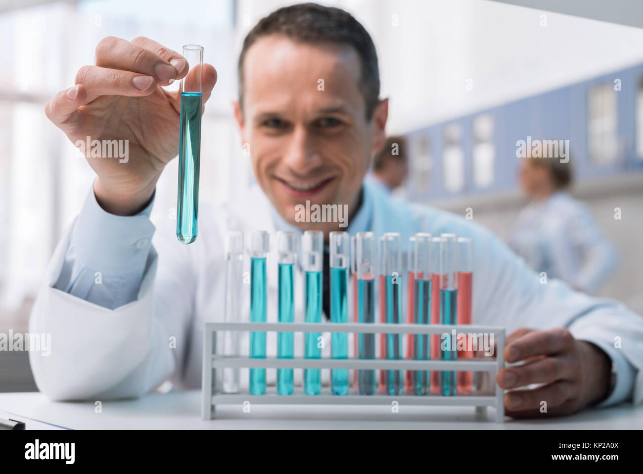 Scientist working with test tubes Stock Photo - Alamy