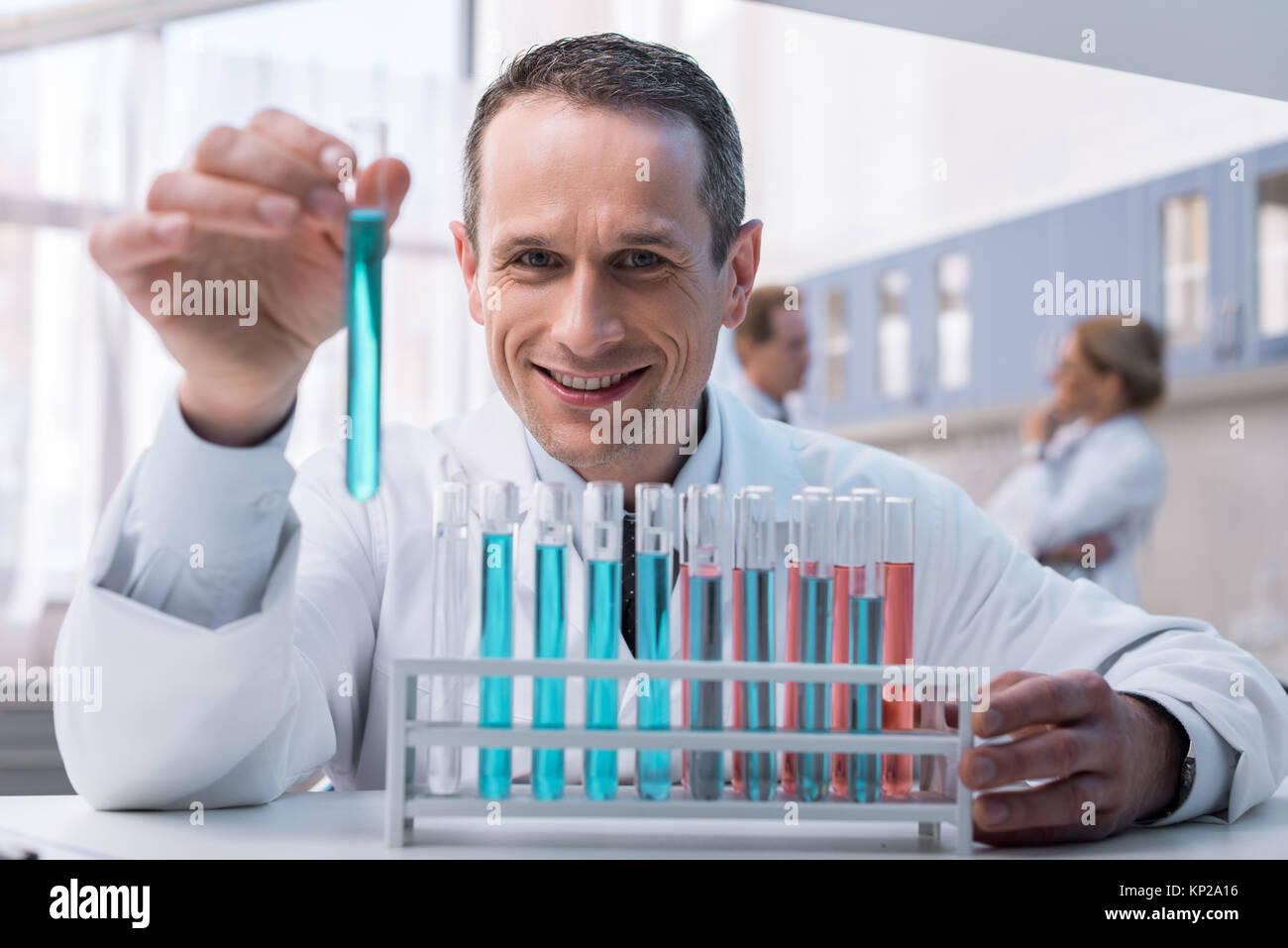 Scientist working with test tubes Stock Photo - Alamy