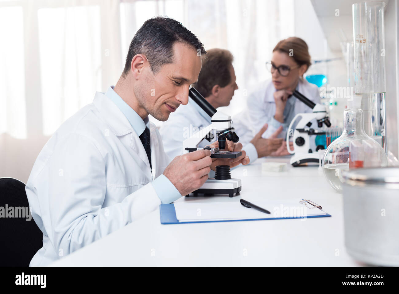 scientist using microscope Stock Photo - Alamy
