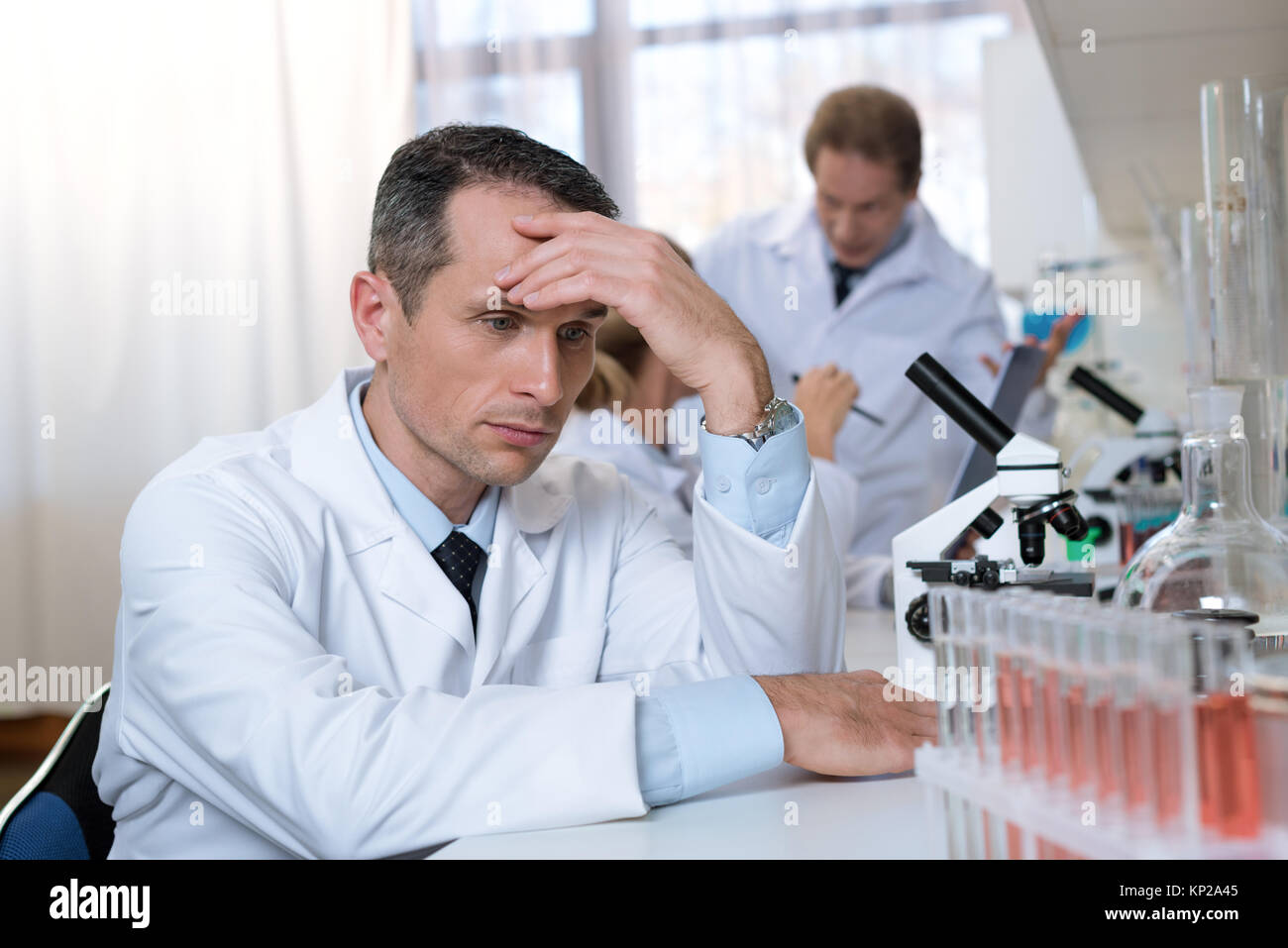 Stressed scientist in lab Stock Photo - Alamy