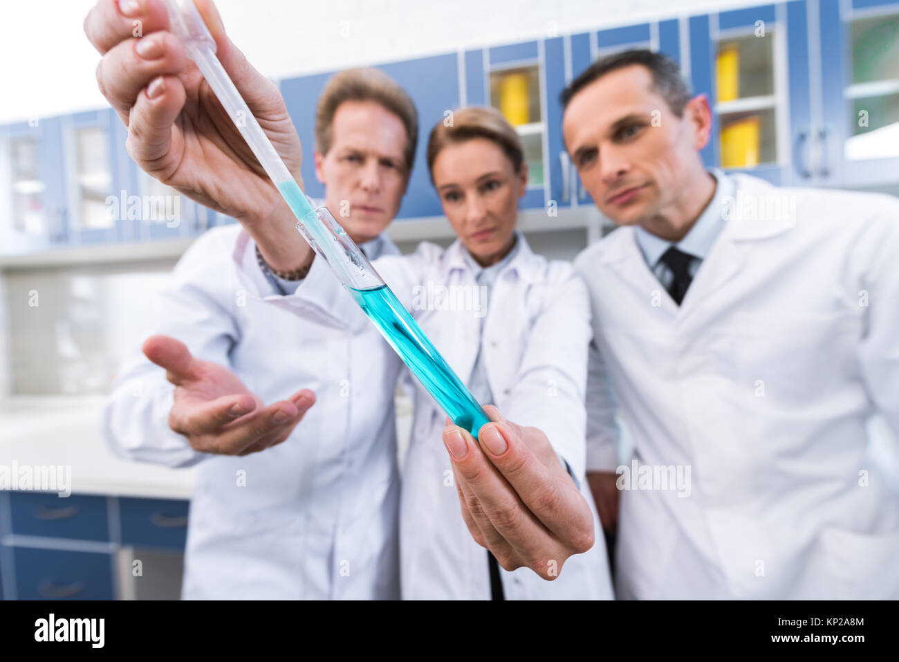 Scientists making experiment Stock Photo - Alamy