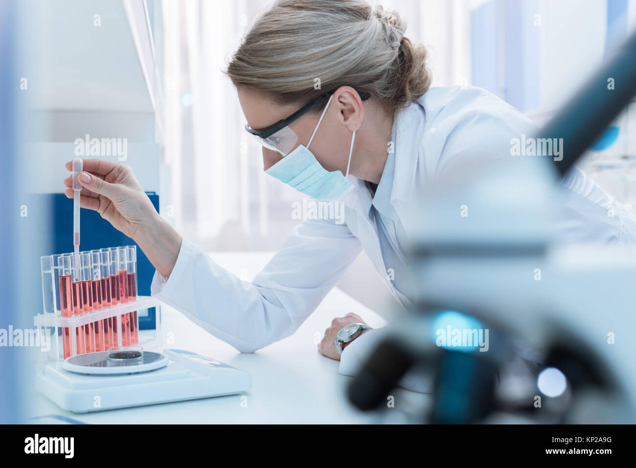 Scientist making experiment Stock Photo - Alamy