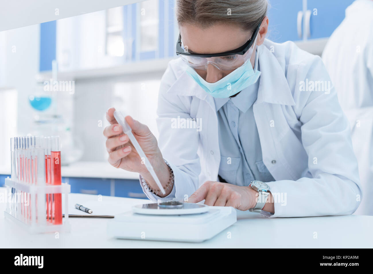 Scientist woman microscope examining samples hi-res stock photography ...