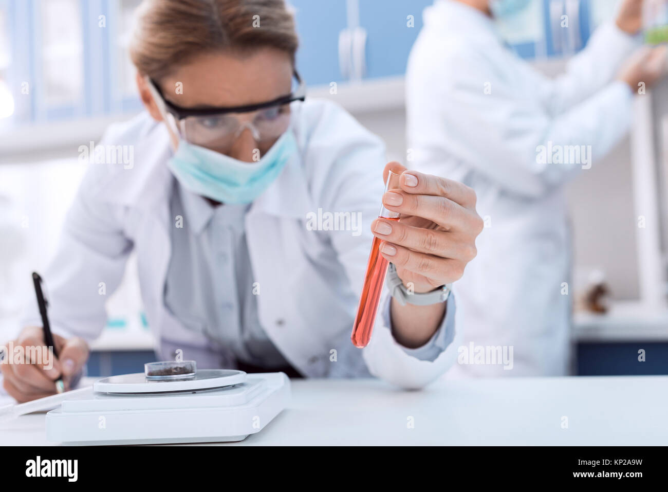 Scientist making experiment Stock Photo - Alamy