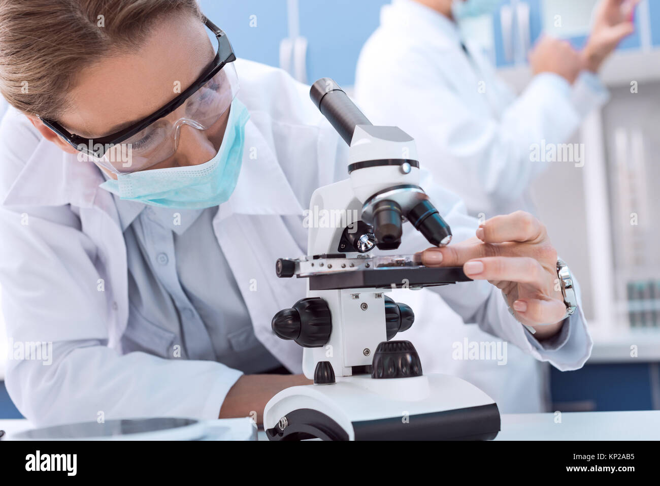 Scientist using microscope Stock Photo - Alamy