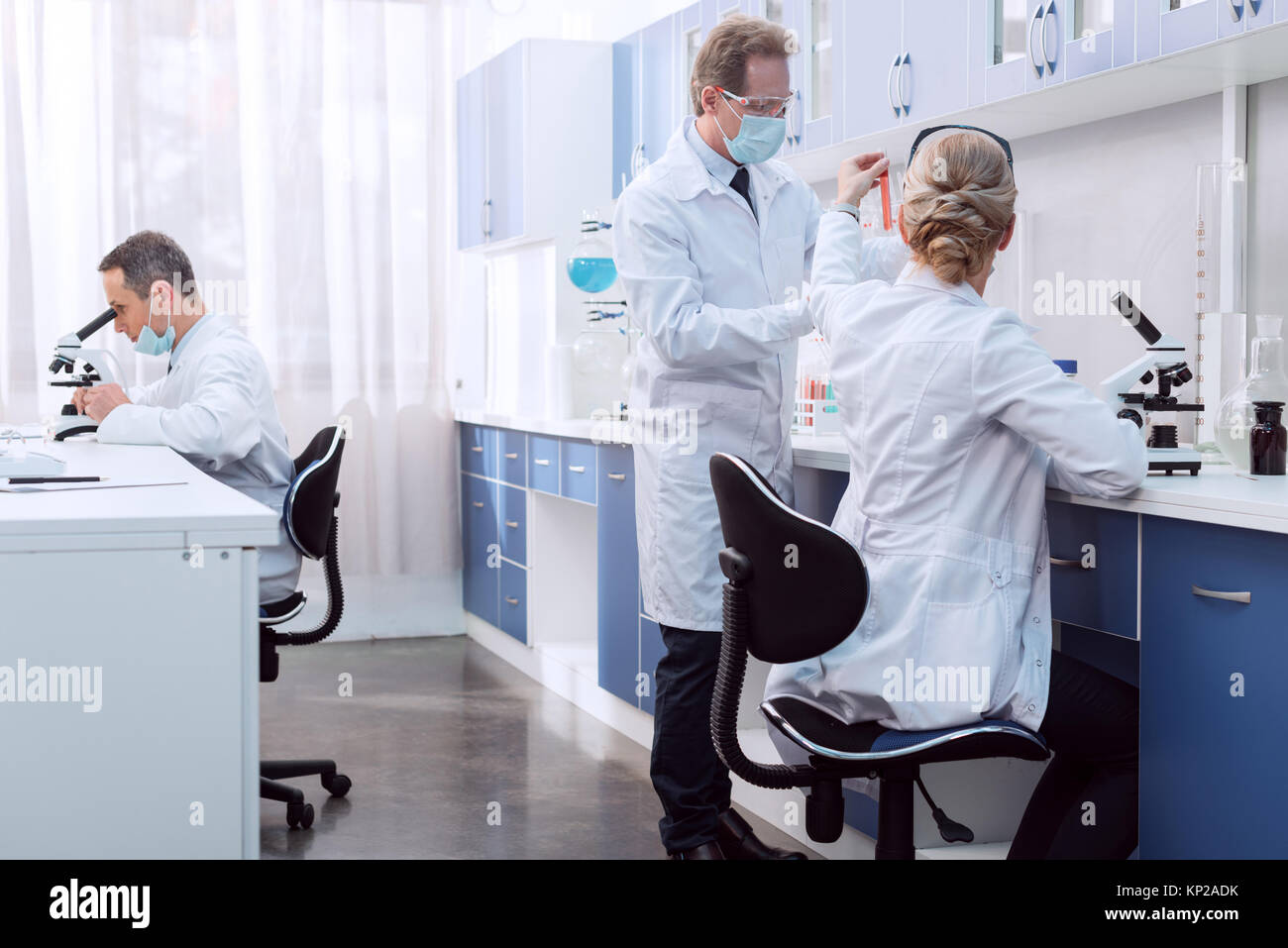 Scientists working in laboratory Stock Photo - Alamy