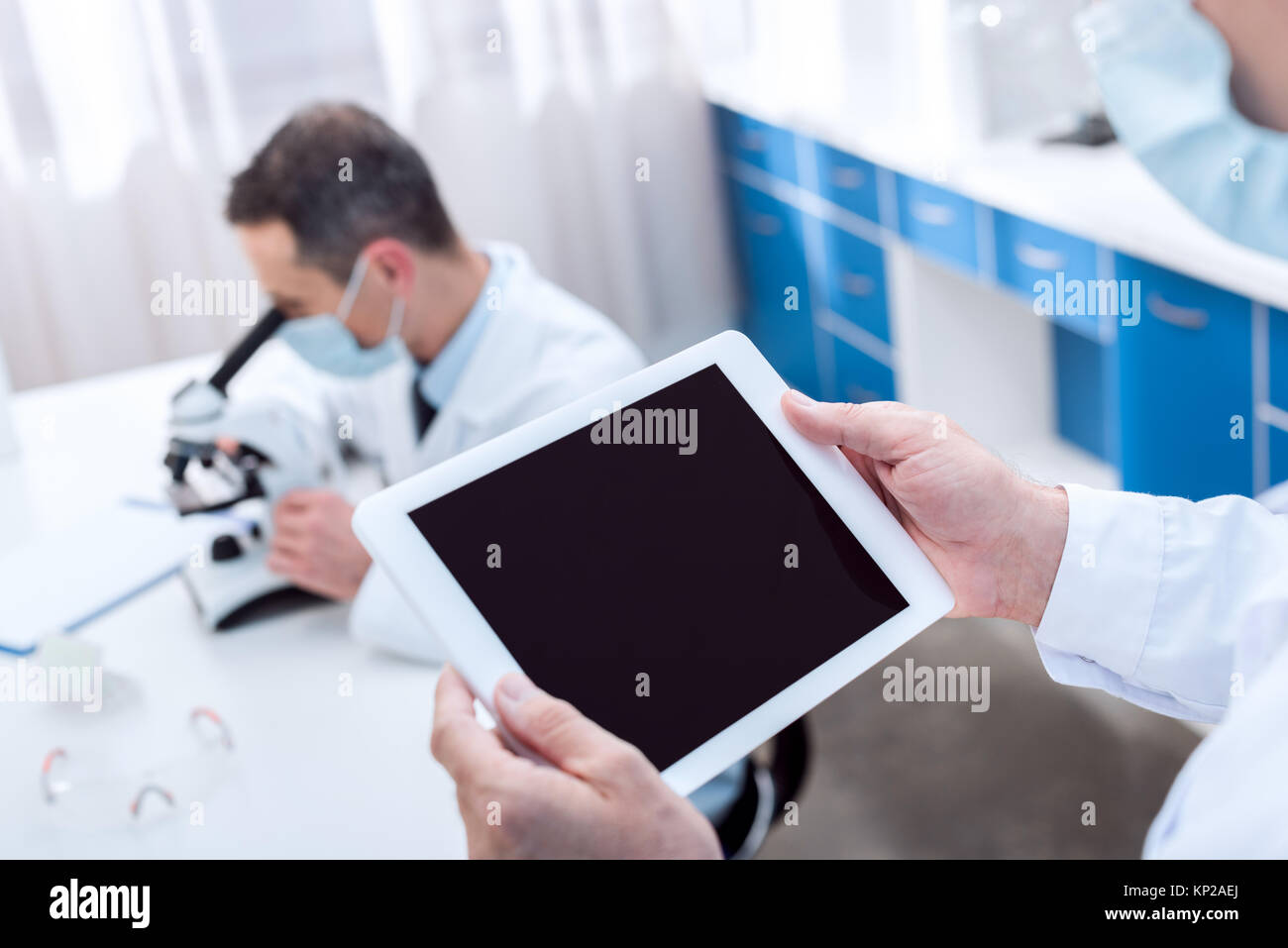 Scientist holding digital tablet Stock Photo - Alamy