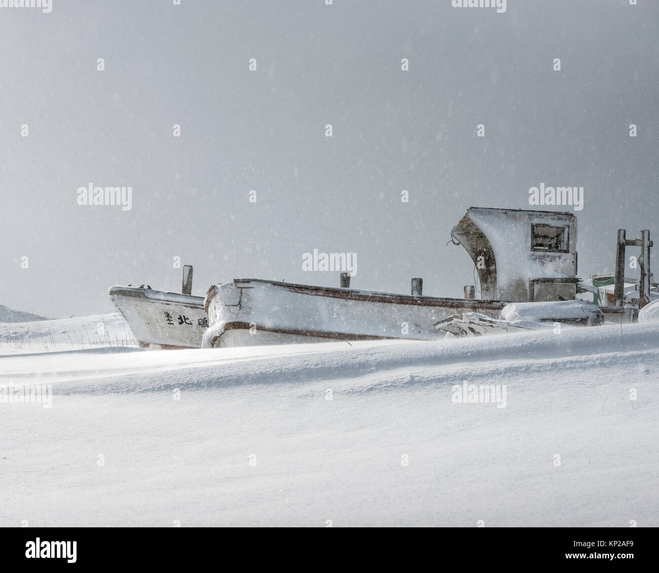 Fishing boats in the snow, Hokkaido, Japan Stock Photo - Alamy
