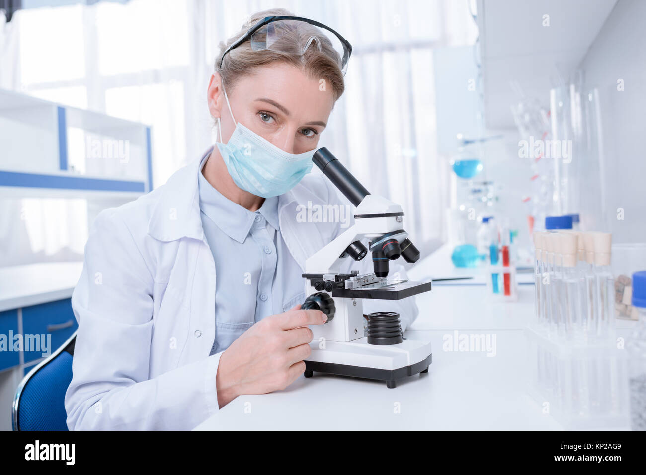 Scientist working with microscope Stock Photo - Alamy