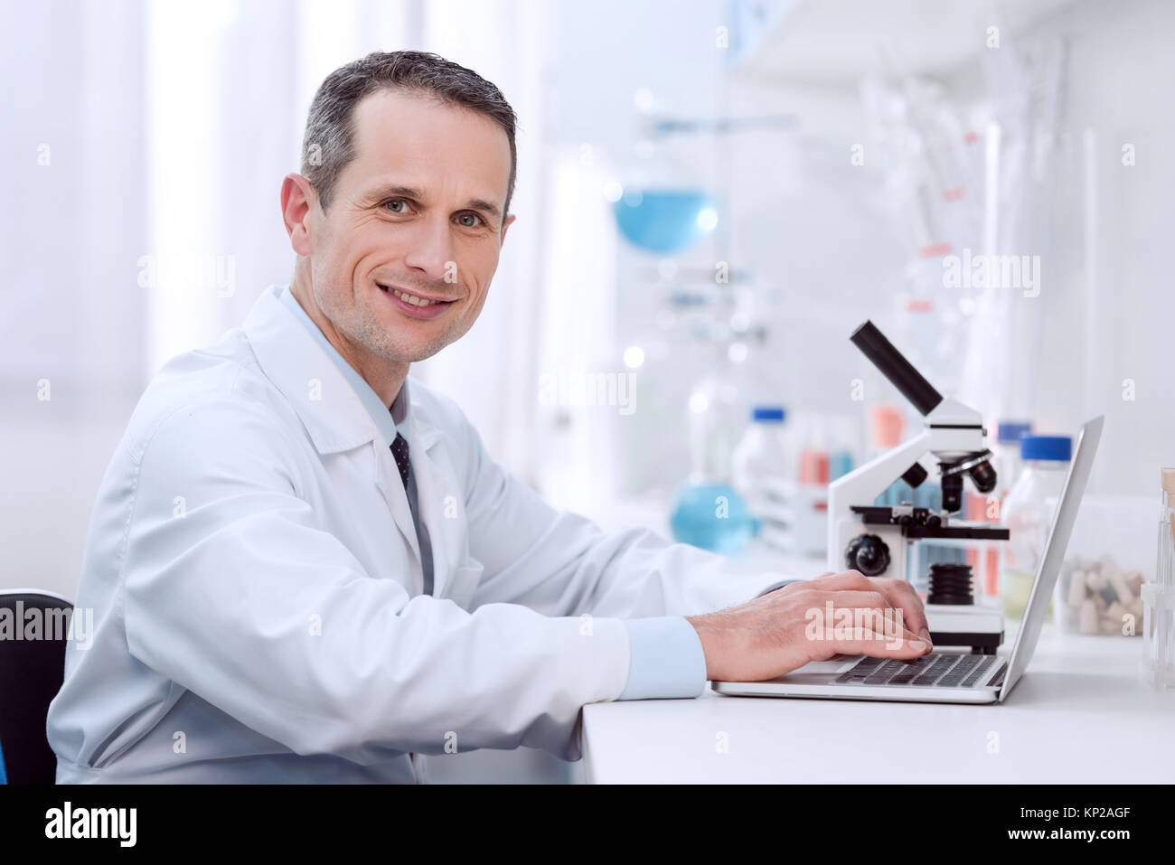 Scientist using laptop Stock Photo - Alamy