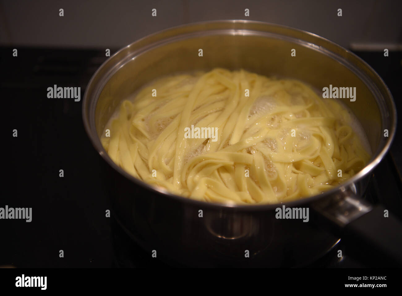 food photography image in color of a saucepan with water boiling and ...