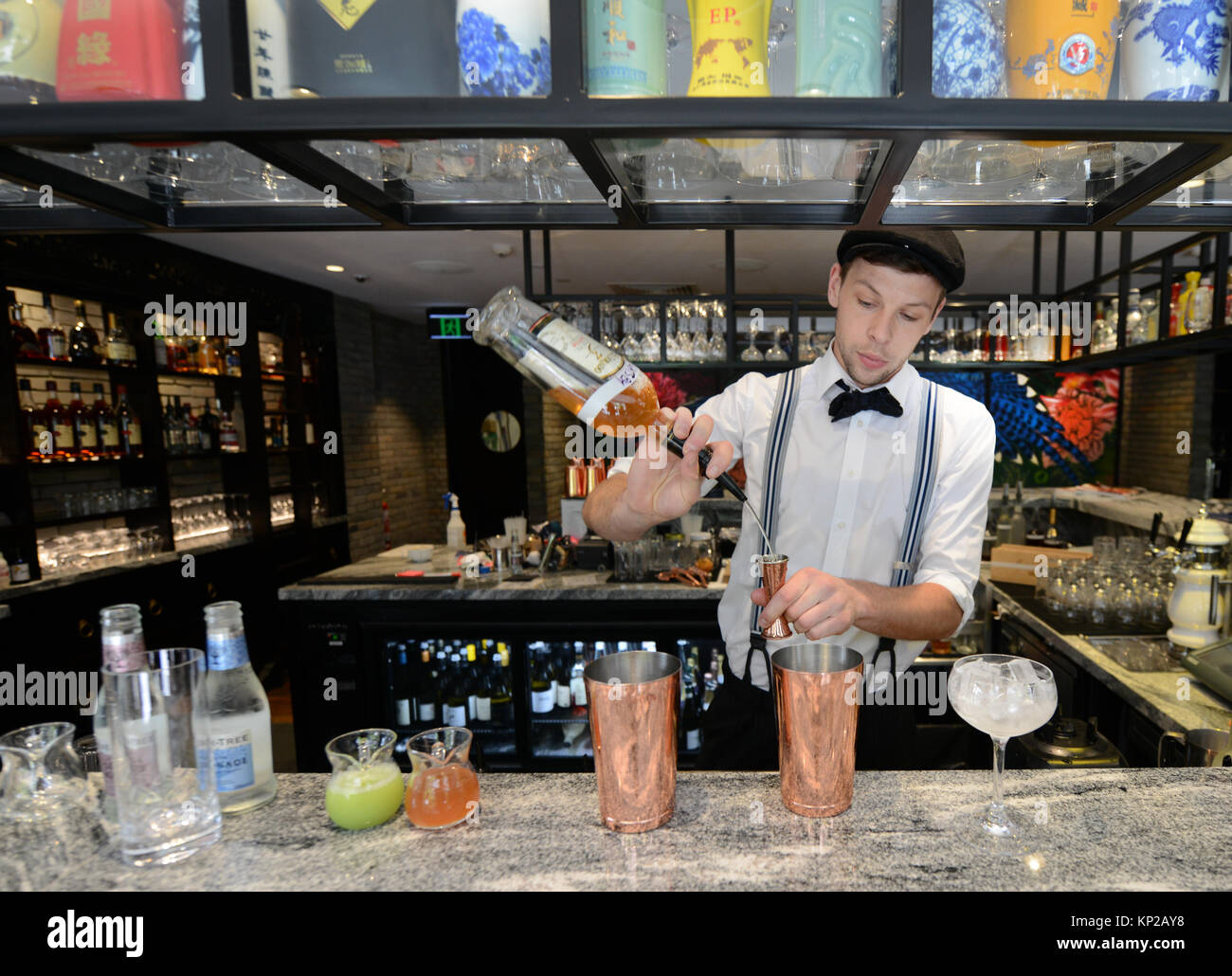 A barman mixing cocktails with Manuka honey Stock Photo - Alamy