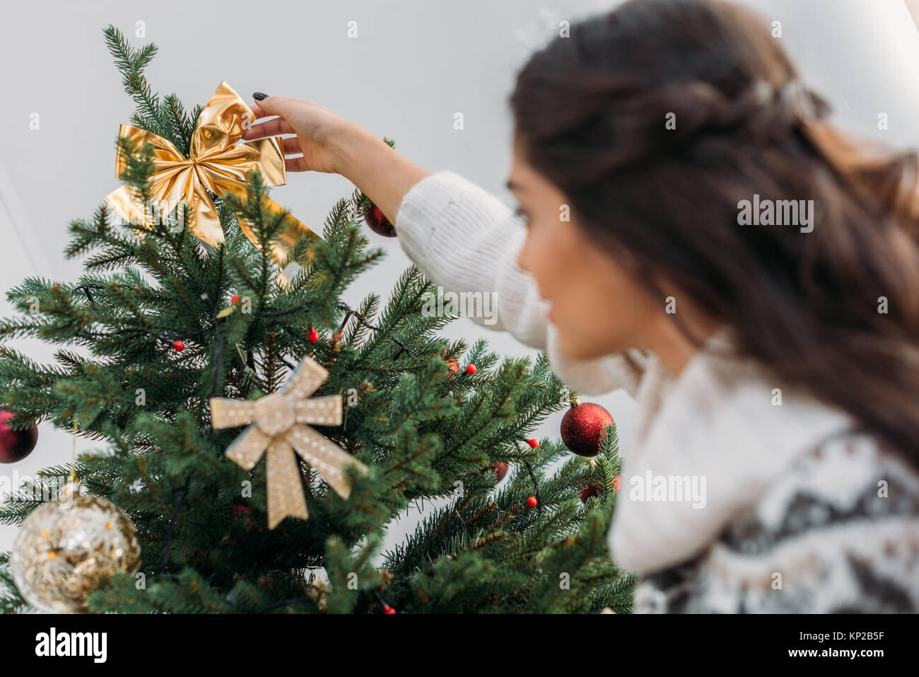 woman decorating christmas tree Stock Photo - Alamy