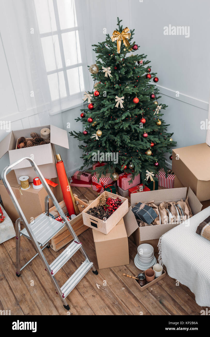 christmas tree with messy boxes on floor Stock Photo - Alamy