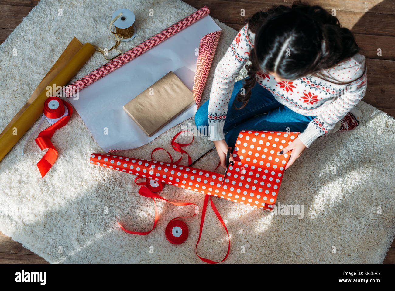 woman packing christmas gift Stock Photo - Alamy