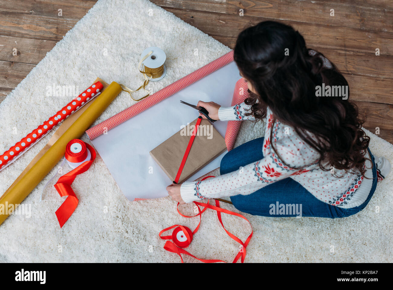 woman packing christmas gift Stock Photo - Alamy