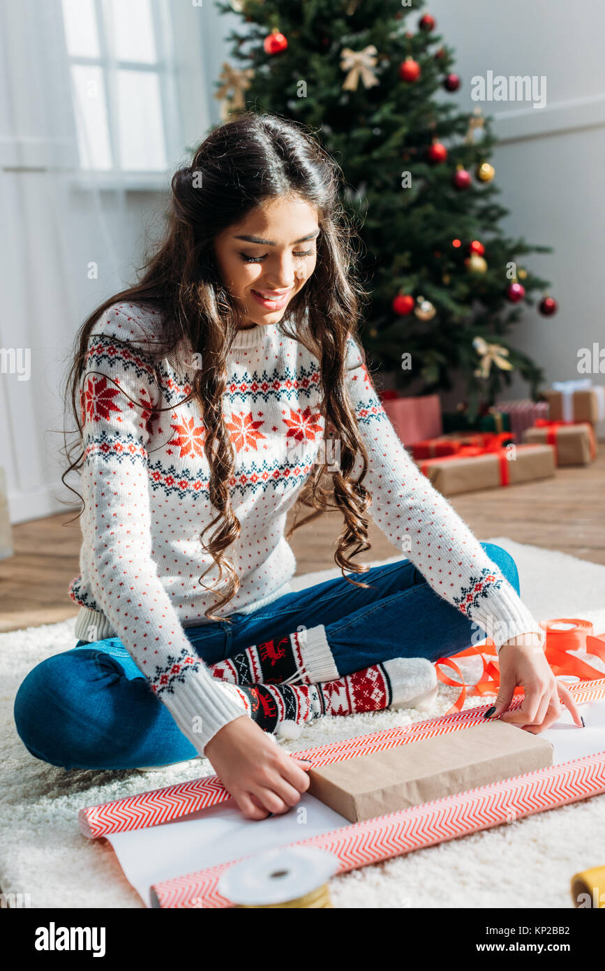 woman packing christmas gift Stock Photo - Alamy