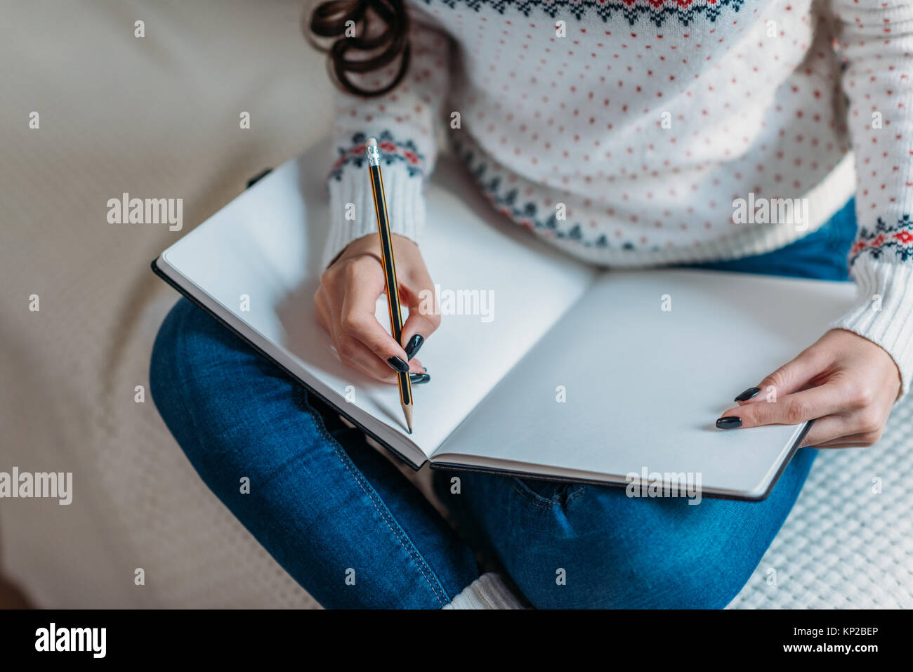 woman writing in notebook Stock Photo - Alamy