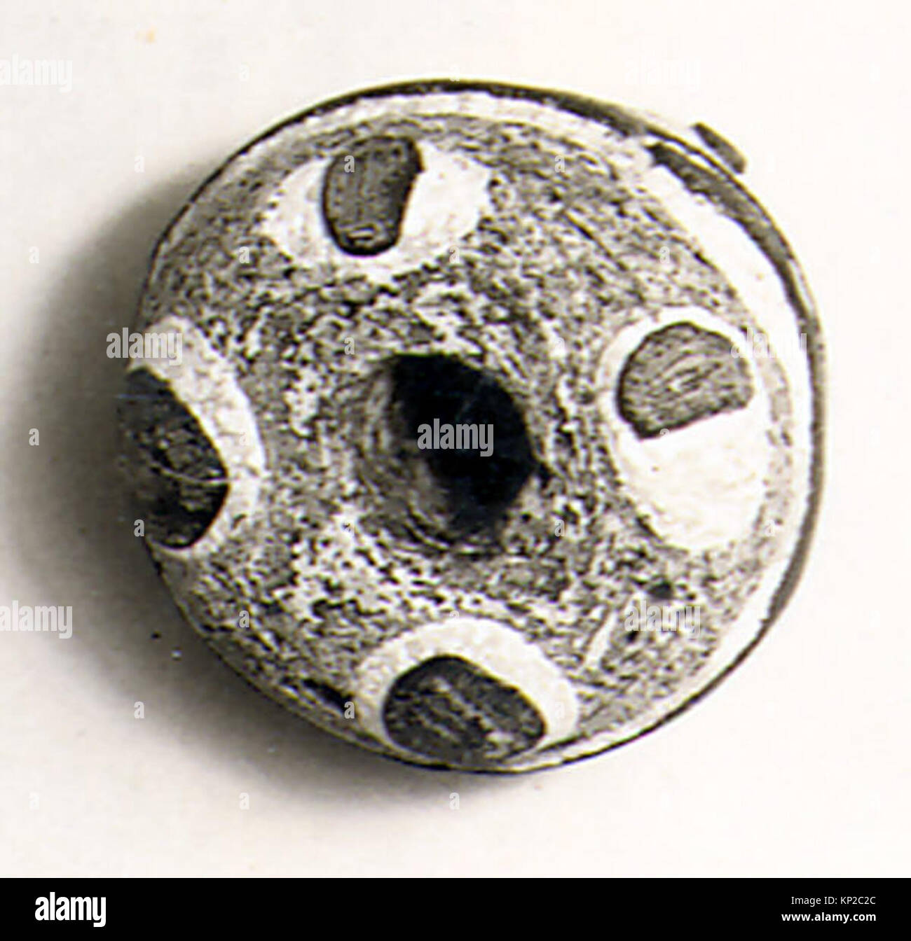 This Carthaginian glass bead from the mid-4th century BCE is ...
