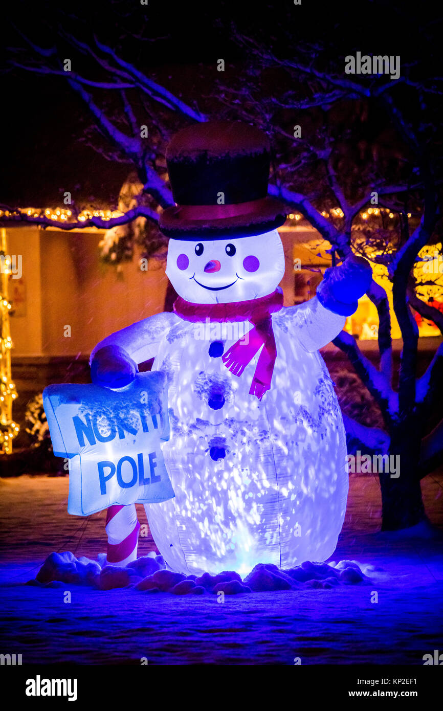 Inflatable Snowman at night on the snow Stock Photo - Alamy