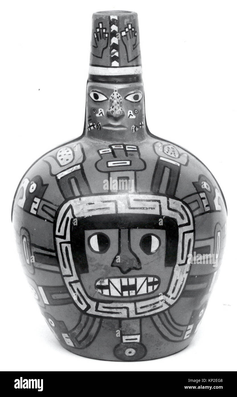 Ceramic bottle with a carved deity face, representing ancient ...