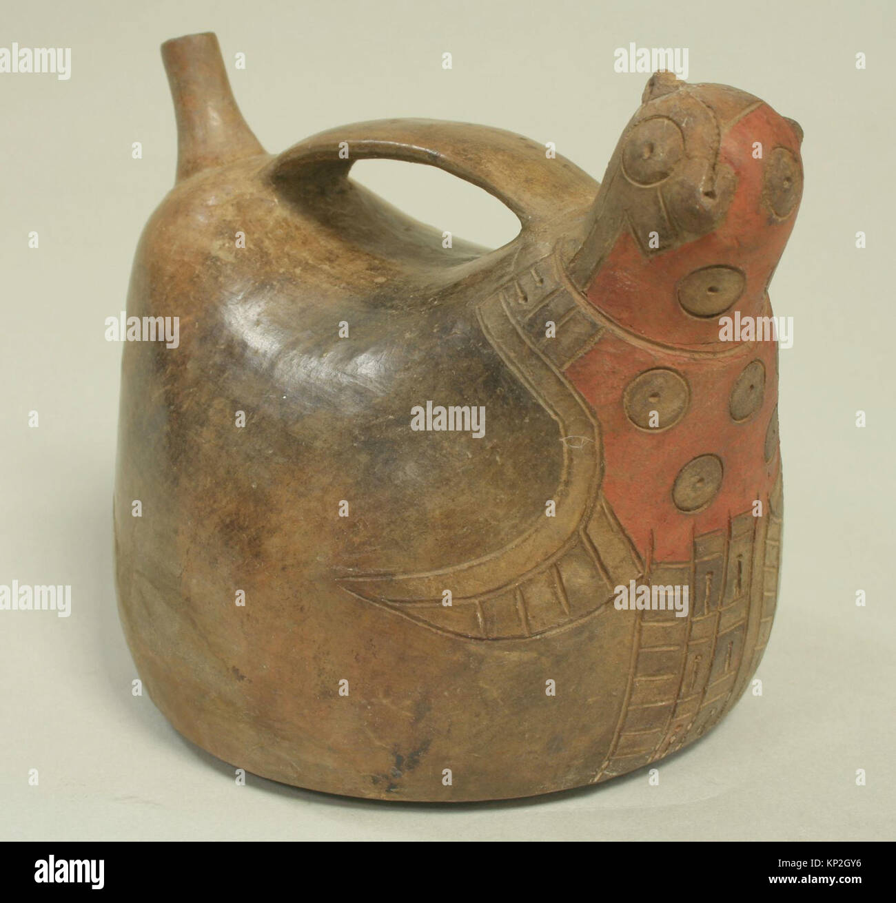 A double spout and bridge bottle featuring a bird motif, illustrating ...