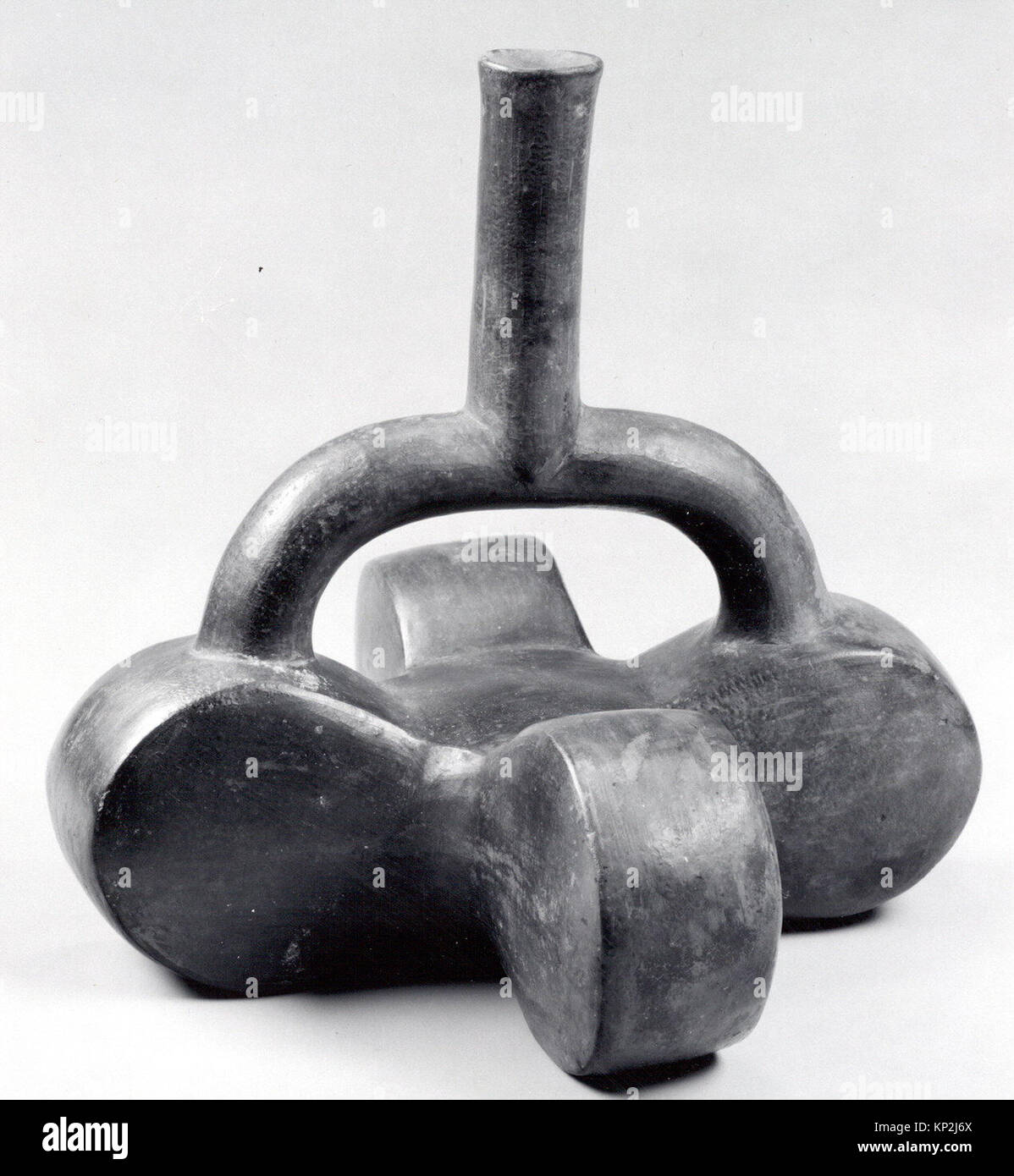 Depiction of a compartmented stirrup spout jar showing dual openings ...