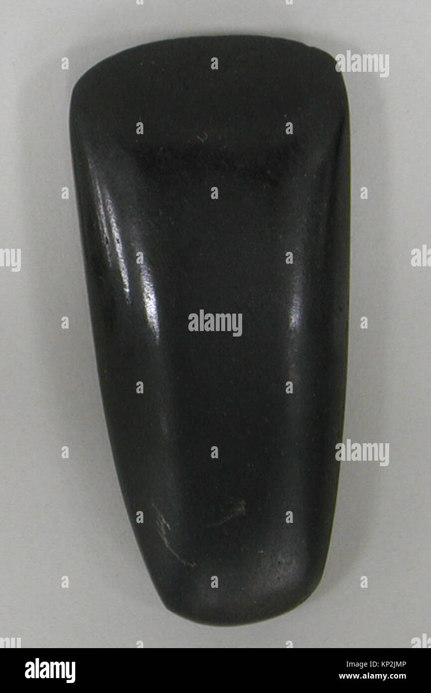 This celt is a prehistoric stone or metal tool, used for chopping or ...
