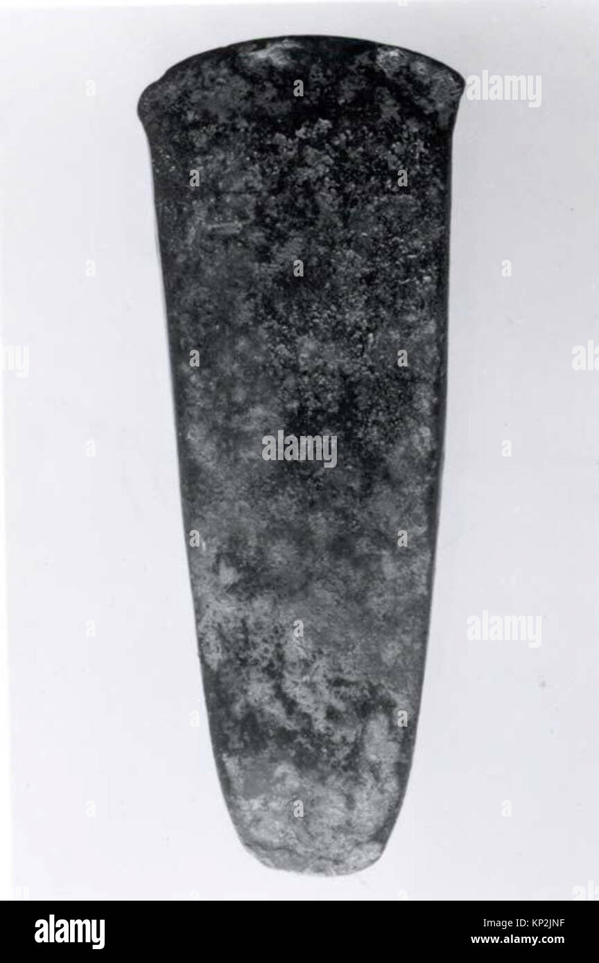 This adze head is a metal tool used historically for woodworking and ...