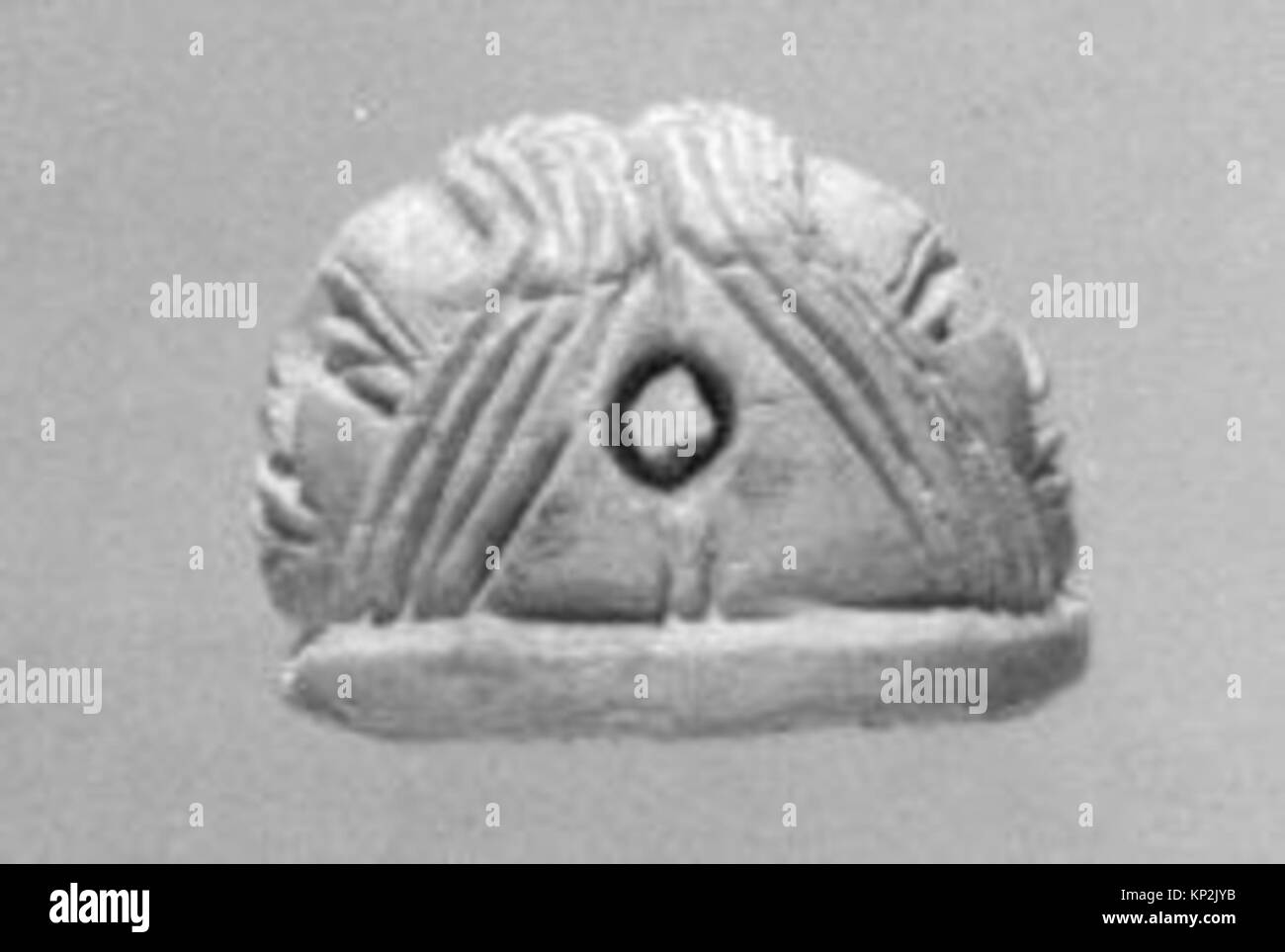 Ancient hemispheroid seal with Egyptian-style human heads from the ...