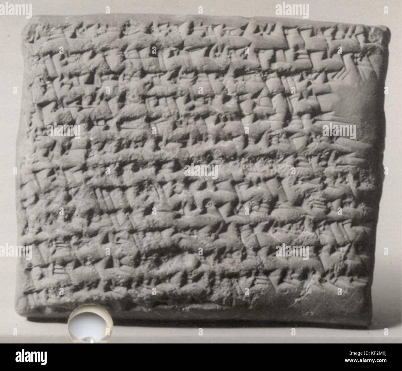 Cuneiform tablet impressed with three cylinder seals and three stamp ...