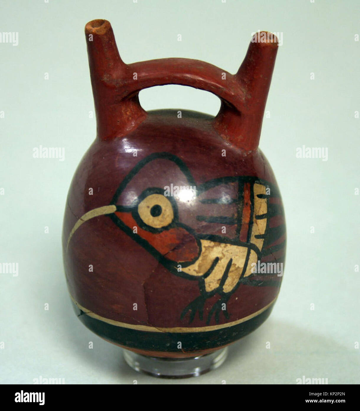 A double spout bottle showing ceramic form, dual openings, and ...
