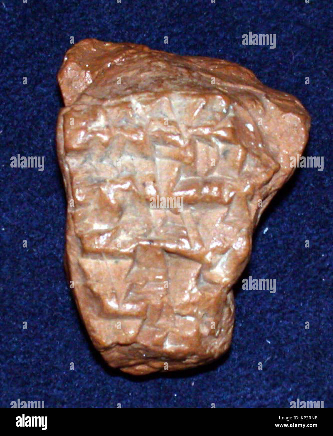A fragment of an ancient cuneiform tablet from Mesopotamia, inscribed ...