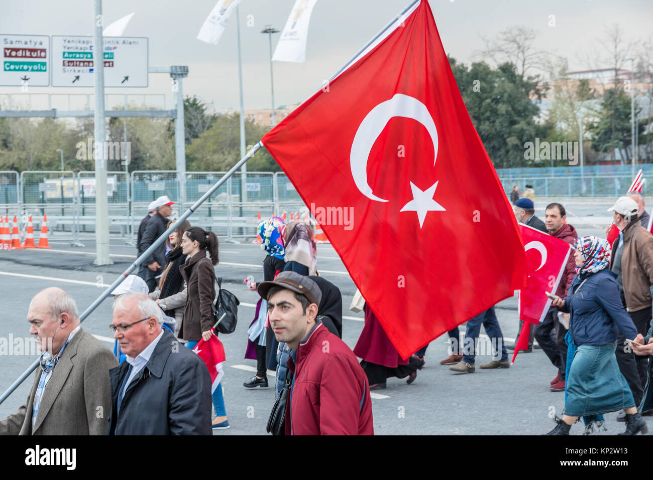 AKP (Justice and Development Party) supporters shout slogans and wave ...