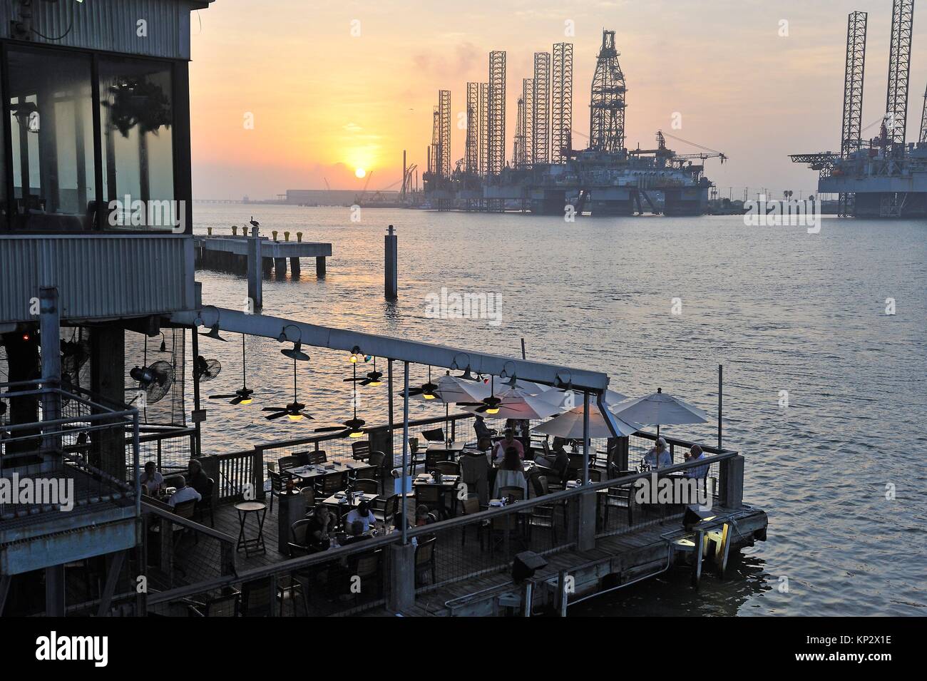 terrace of the Fisherman´s Wharf restaurant with oil platform in the ...