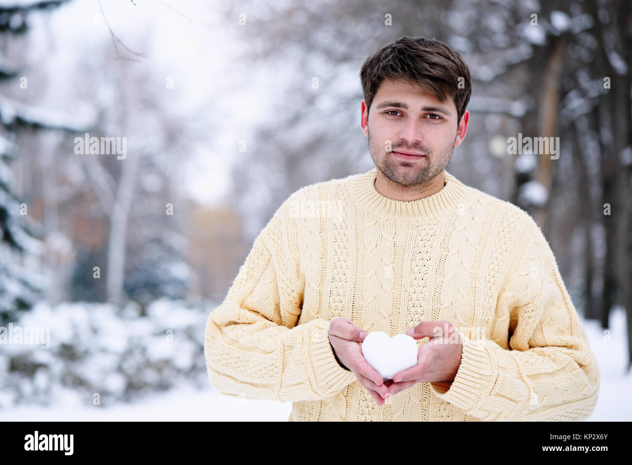 Handsome guy holding the heart Stock Photo - Alamy