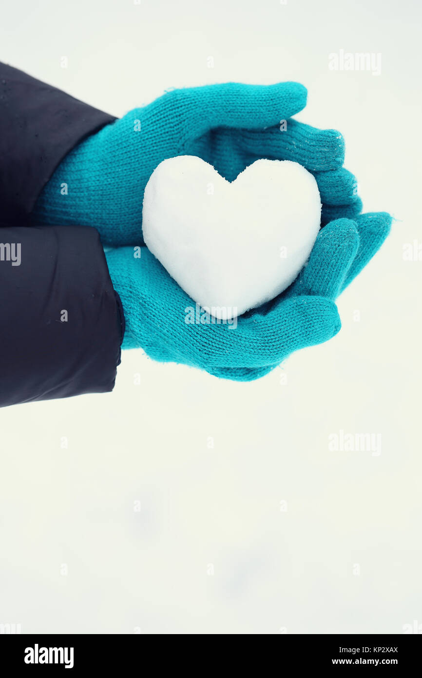 Snowball in the shape of a heart, Close-up Stock Photo - Alamy