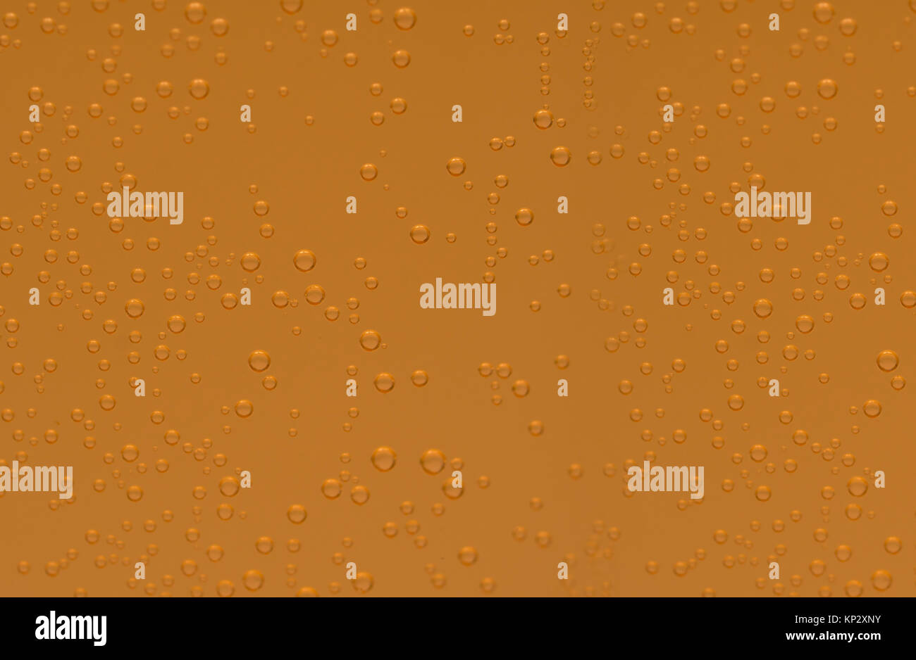 Macro shot of orange effervescent bubbles of calcium and vitamin C ...