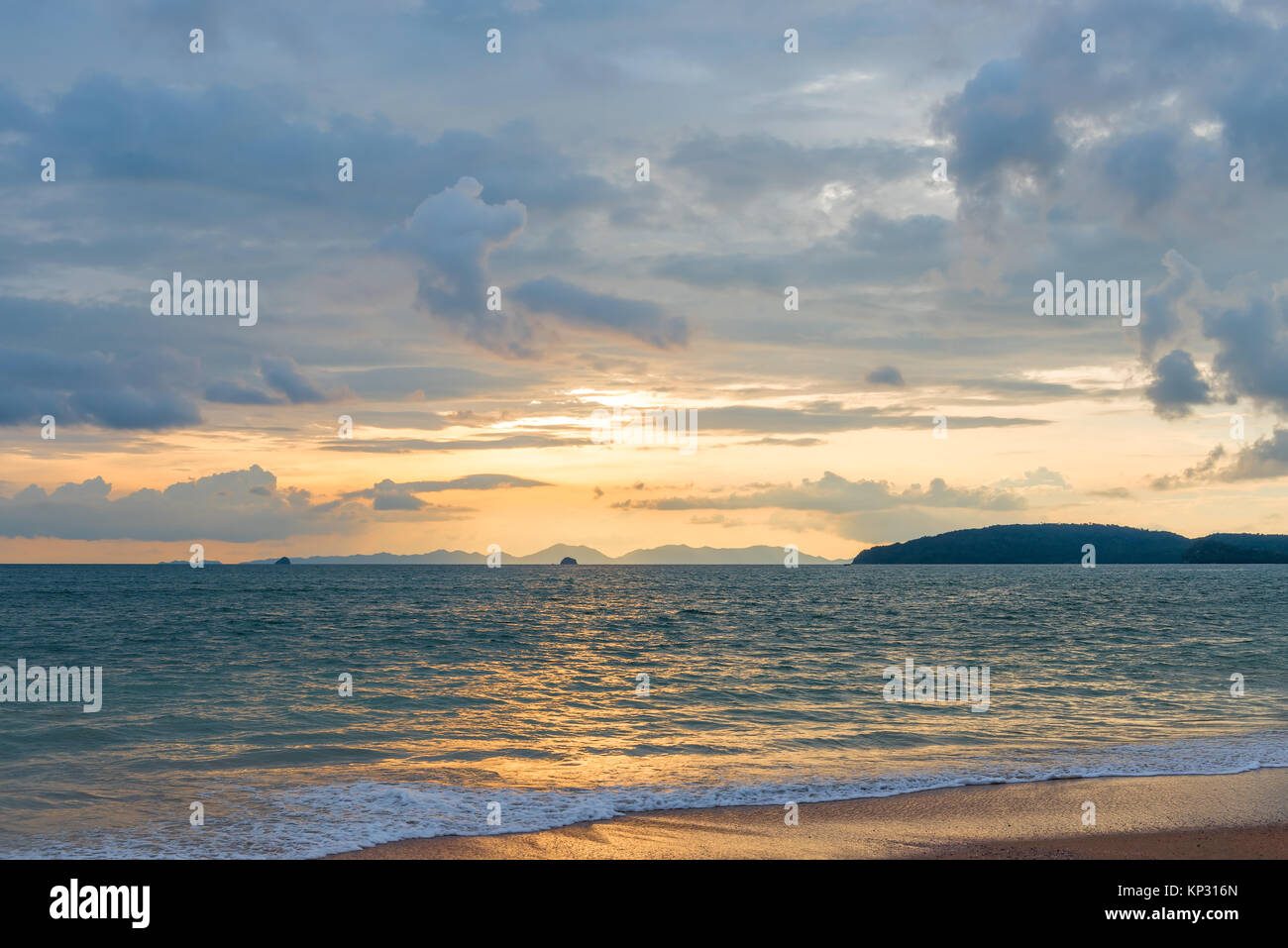 Sunset in Thailand in orange colors - view of the mountains and the sea ...