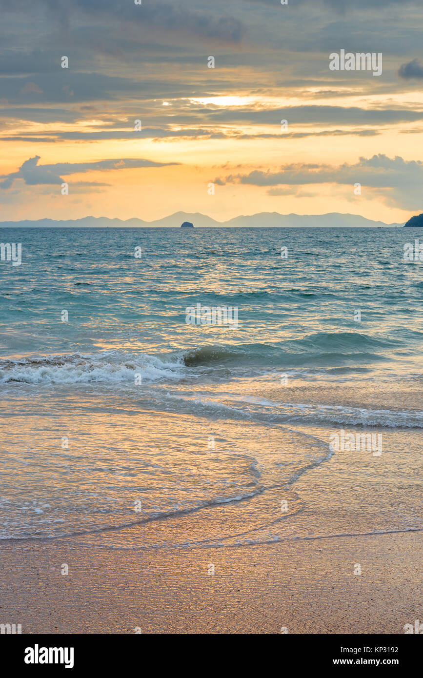 beautiful open picture sea at sunset with mountains on the horizon ...