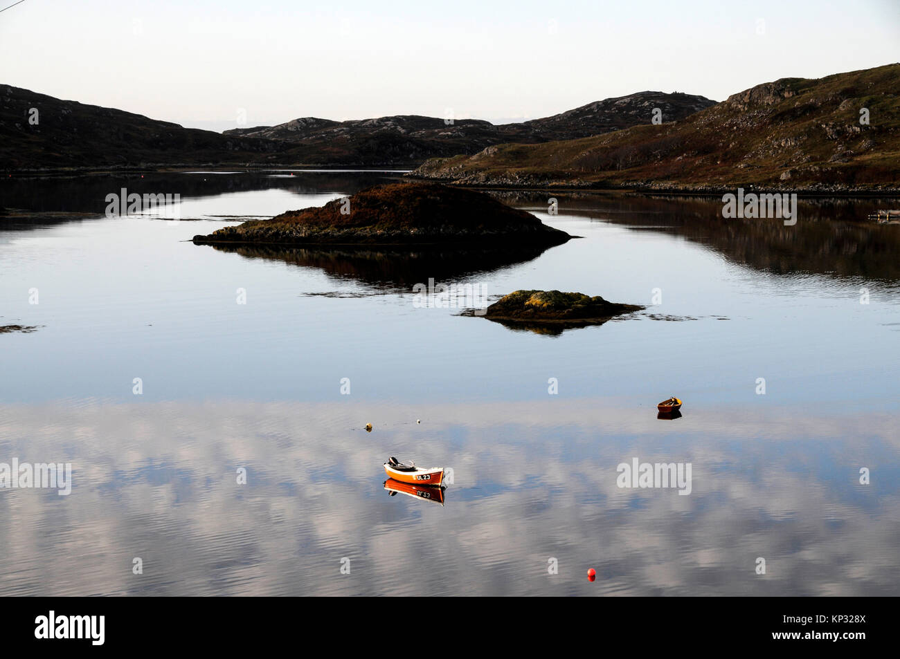A moored rowing boat in Badcall Bay in Sutherland, northwest Scotland ...
