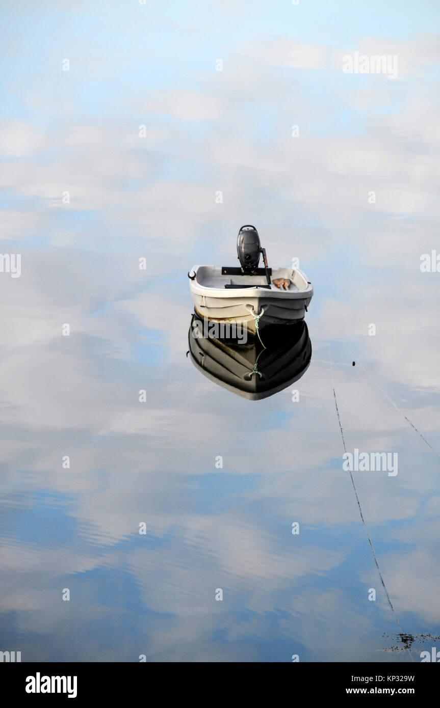 A moored rowing boat in Badcall Bay in Sutherland, northwest Scotland ...