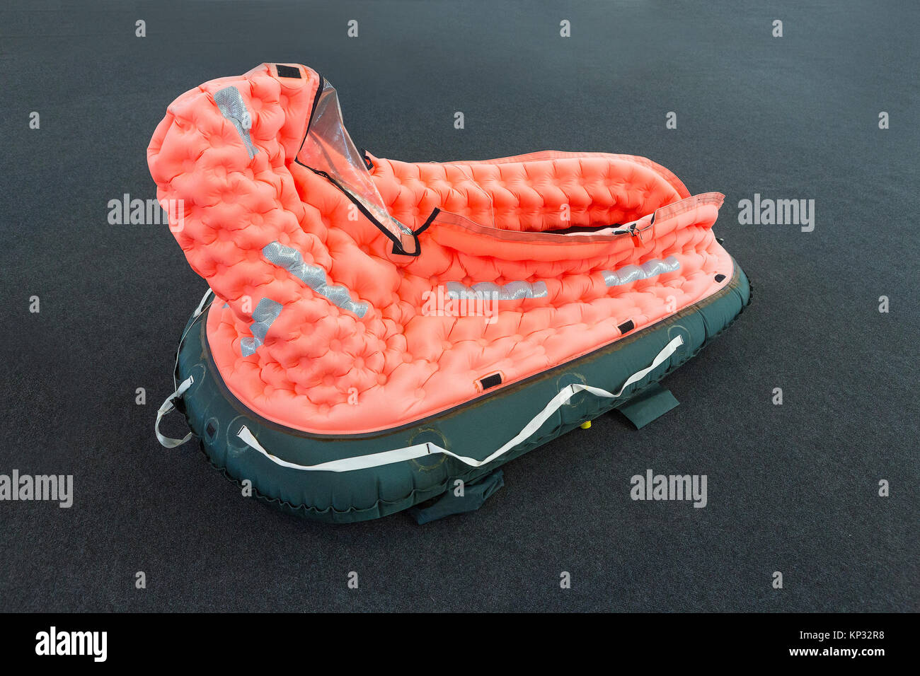 Red self-inflating life raft for small aircraft Stock Photo - Alamy