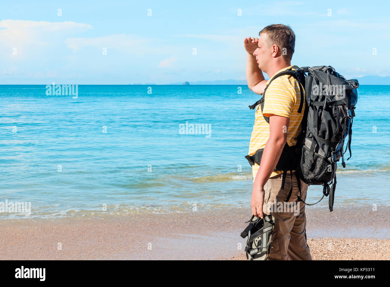 man tourist on holiday on a hike enjoys the sea Stock Photo - Alamy
