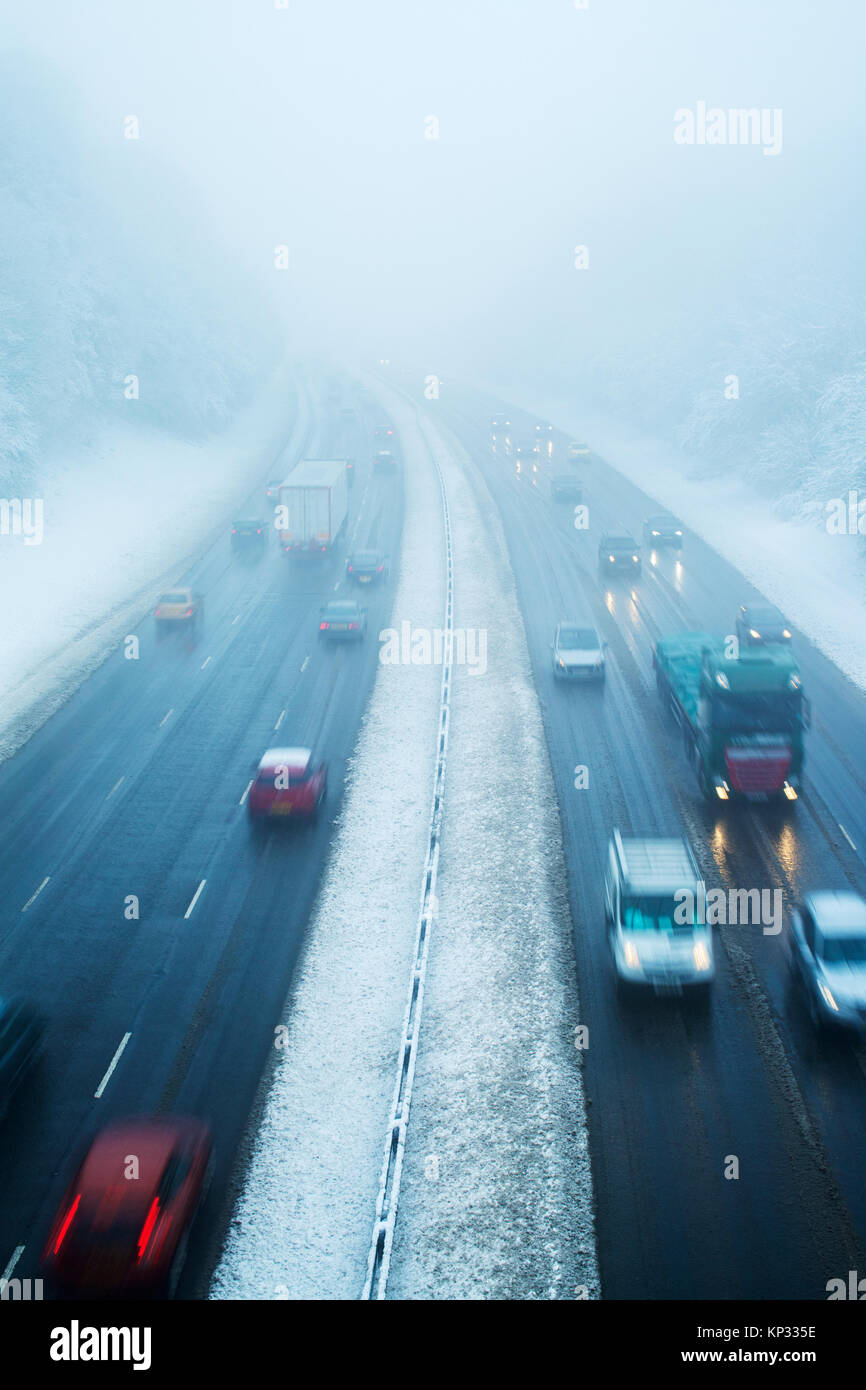 Traffic On Motorway During Snow Storm Stock Photo - Alamy