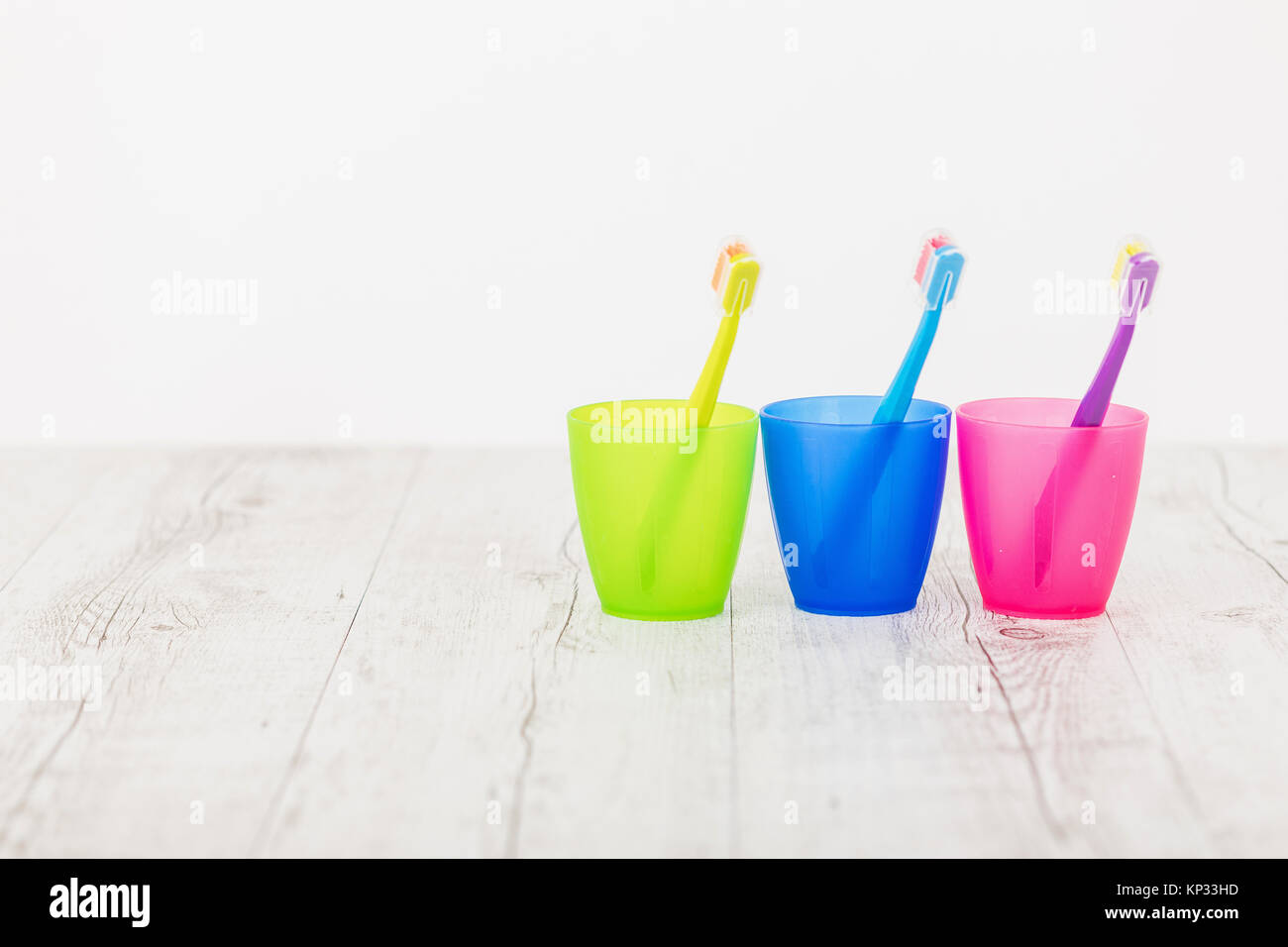 New color ultra fine toothbrushes in colorful glasses. Dental Industry ...